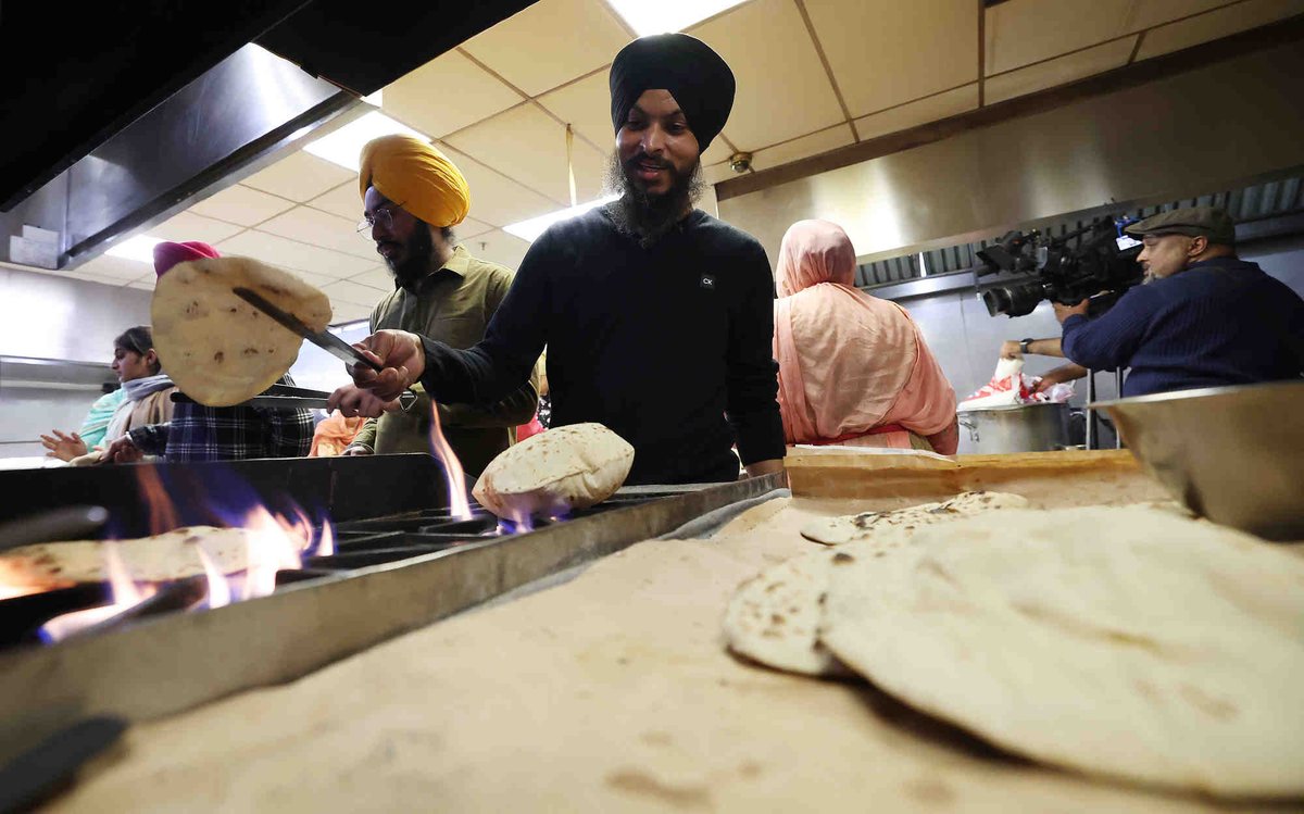 Sikh worshippers gather at the Gurdwara, feast and light candles as ...