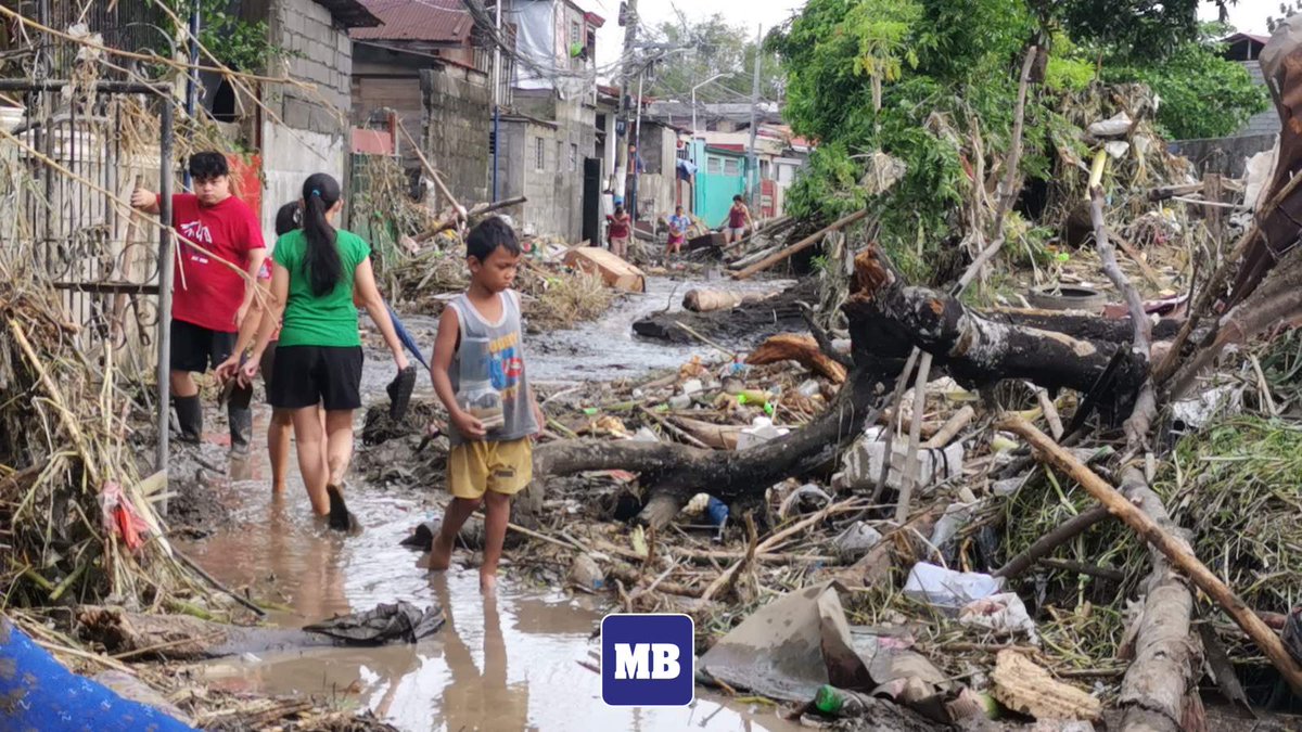 LOOK: Residents clean a mud-covered street in Noveleta, Cavite on ...