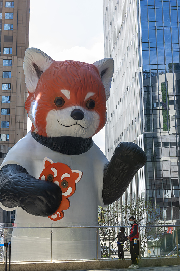 Hi, passersby! A 17-meter-high red panda art installation greets ...