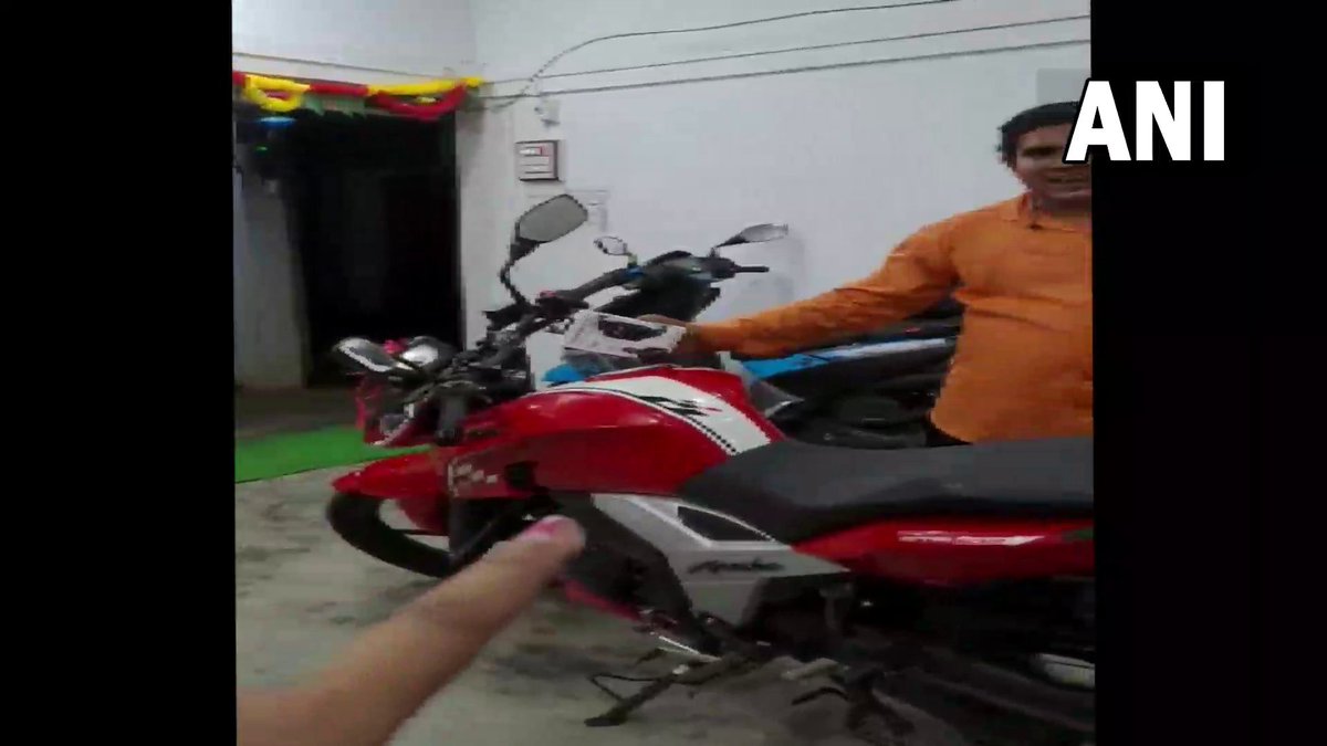 ANI on Twitter: "Suranjan Roy, a resident of Assam's Karimganj purchased his dream bike with ...
