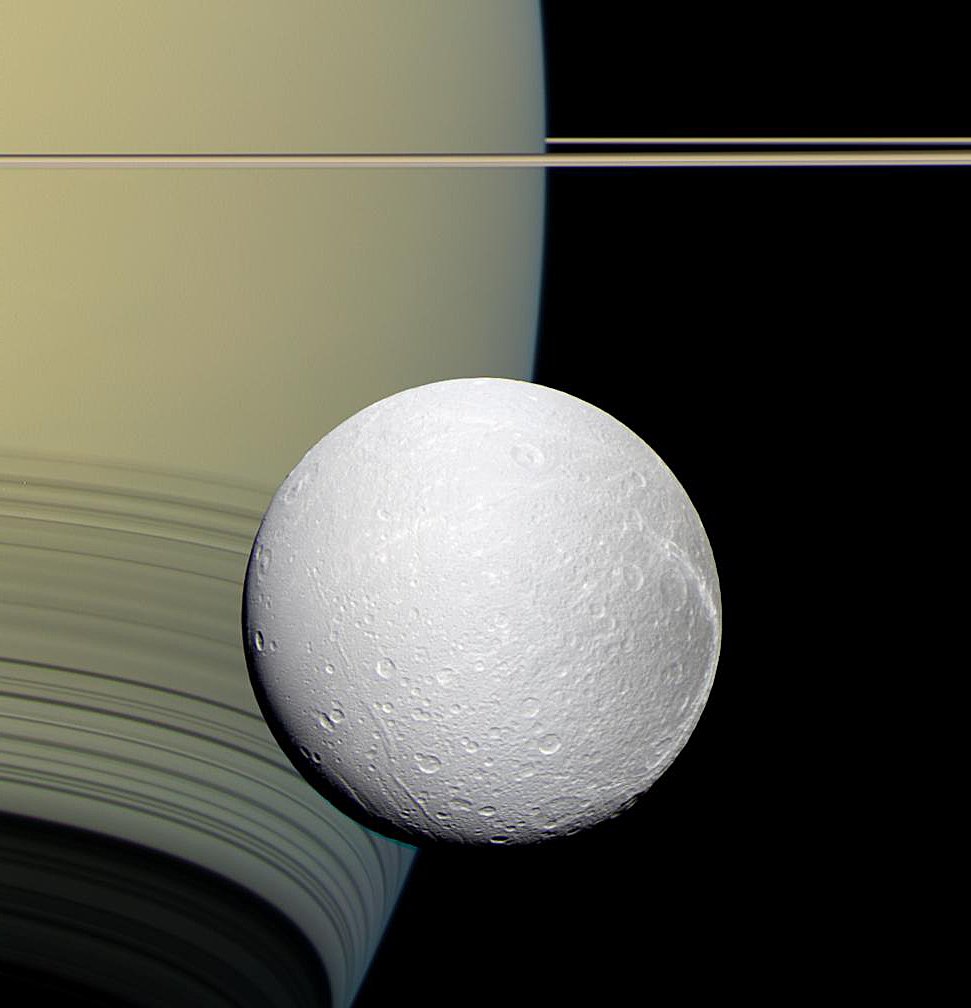 Saturn and its icy moon Dione captured by the Cassini spacecraft. About ...