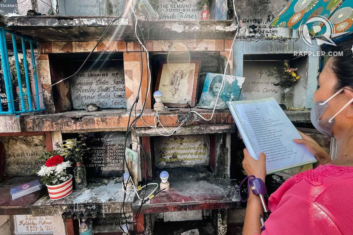 Families visit the graves of their departed loved ones at the Calamba ...