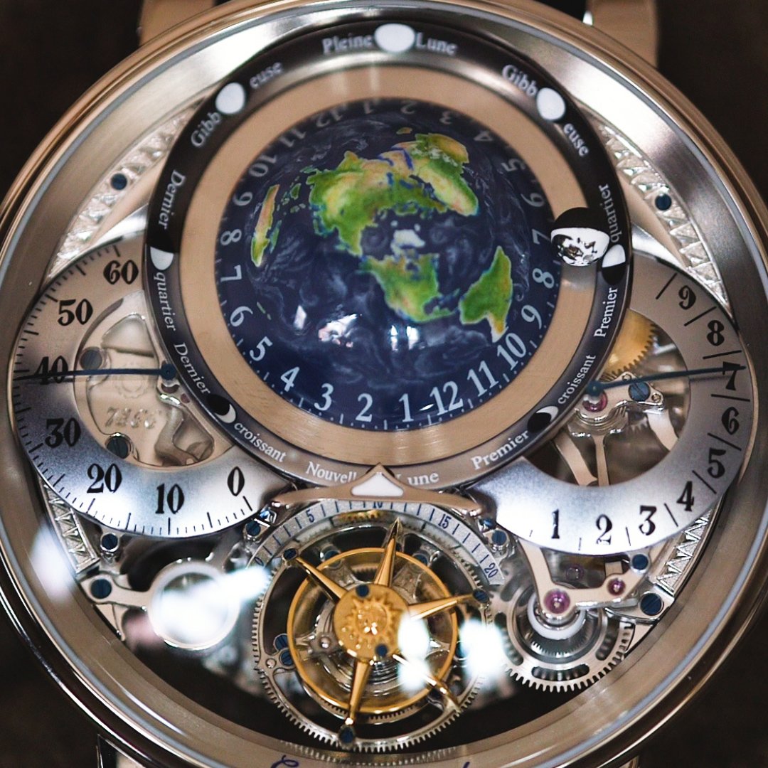 The centerpiece of the watch is a cold enamel miniature painting of a ...