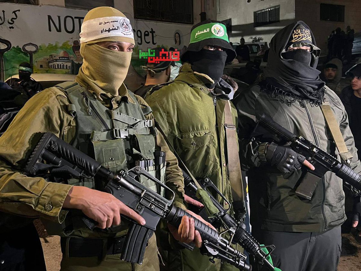 Armed Palestinians militants (Members of Jenin Battalion) marching in ...