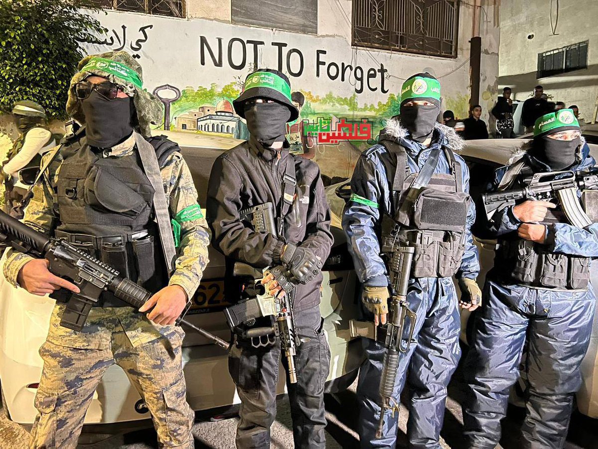 Armed Palestinians militants (Members of Jenin Battalion) marching in ...