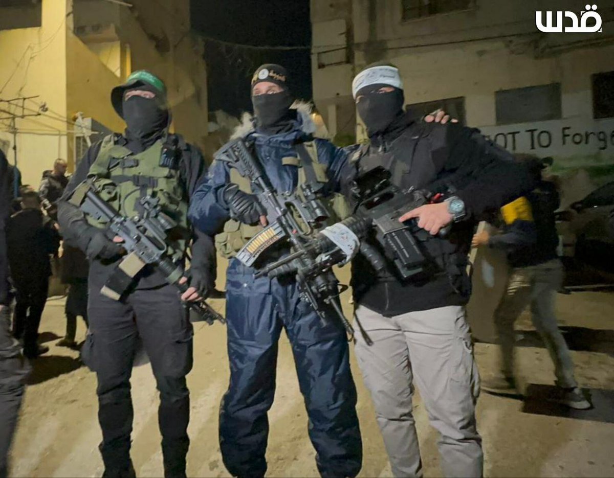 Armed Palestinians militants (Members of Jenin Battalion) marching in ...
