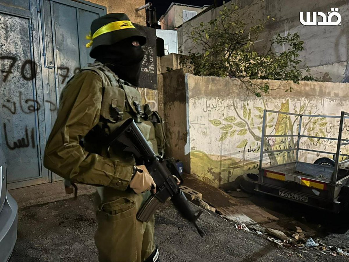 Armed Palestinians militants (Members of Jenin Battalion) marching in ...