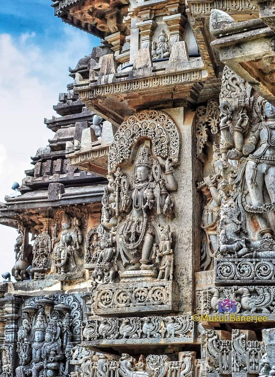 Intricate sculptures adorning the walls of Hoysaleswara Temple ...