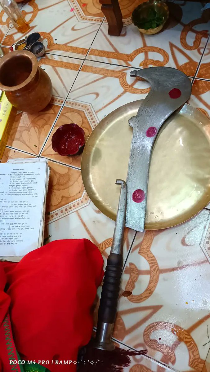 Decorating the Banghāli Khadga [Khnara] with red sindoor during Kali ...