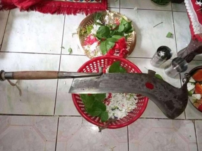 Decorating the Banghāli Khadga [Khnara] with red sindoor during Kali ...