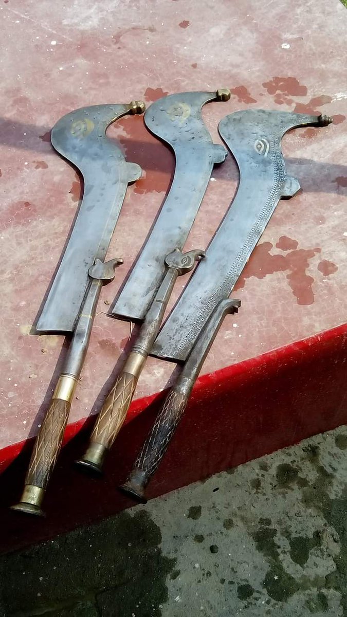 Decorating the Banghāli Khadga [Khnara] with red sindoor during Kali ...