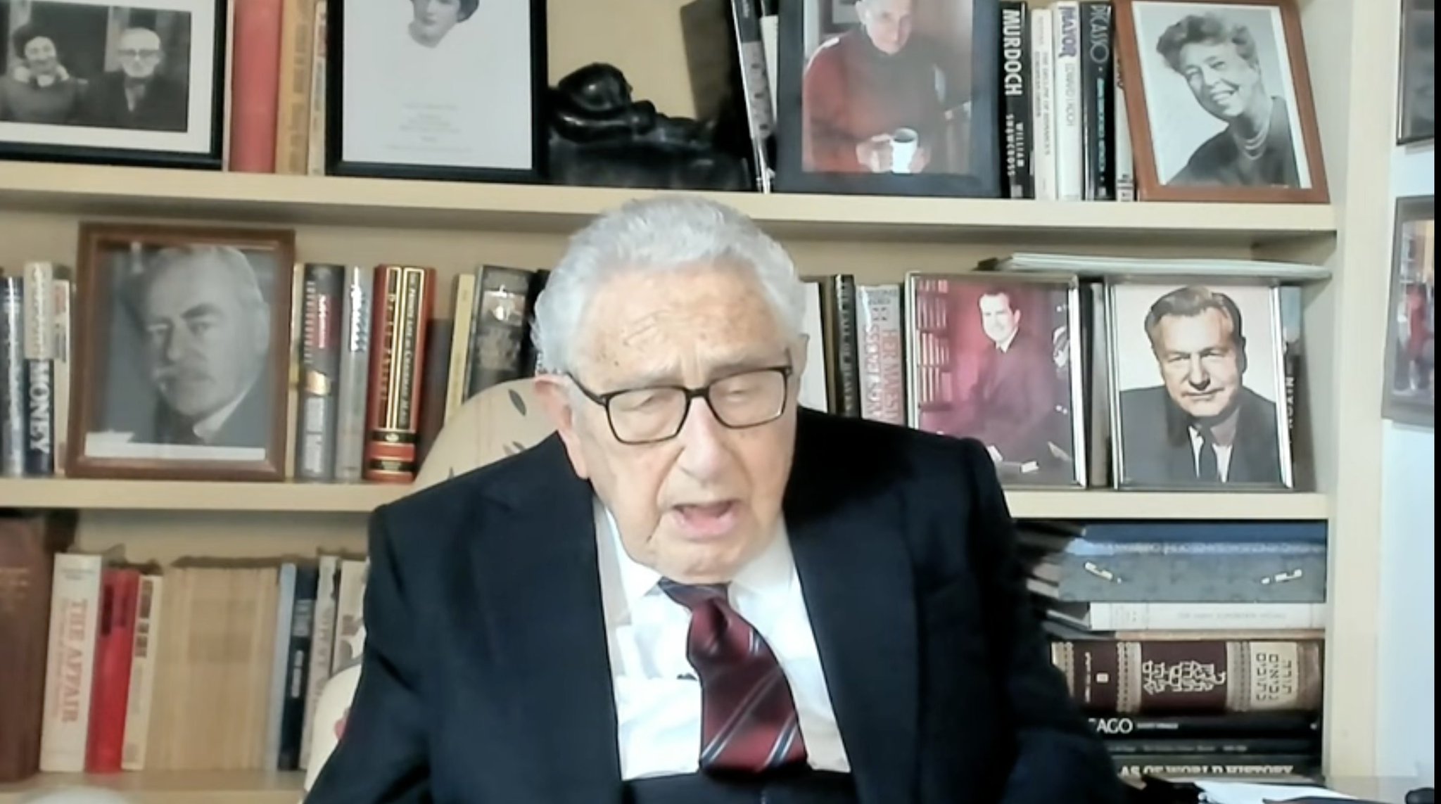 Michael Tracey on Twitter: "Henry Kissinger beams into Davos with a portrait of Richard Nixon ...