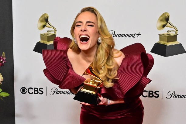 Pop Base on Twitter: "The beautiful Adele with her #GRAMMYs award."