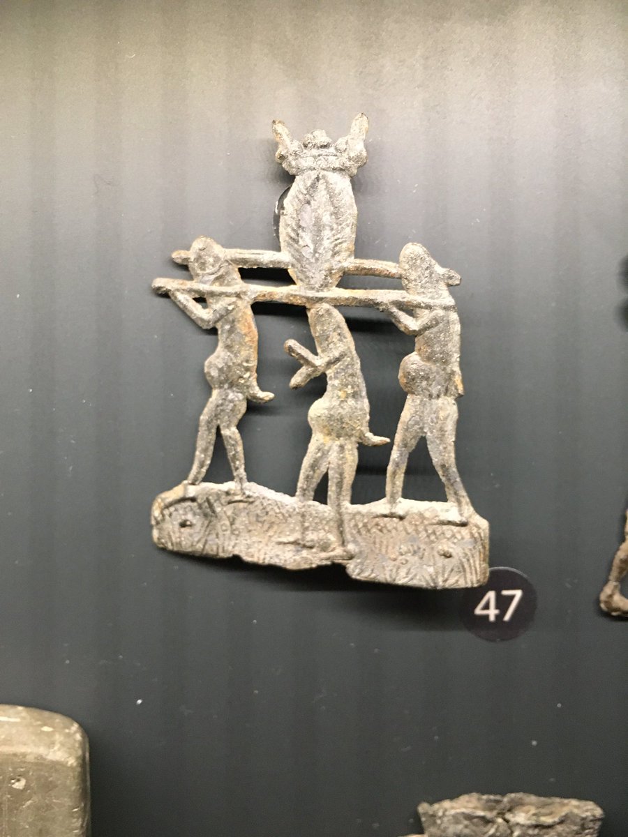 a medieval badge showing a vagina carried by three phalluses with arms ...