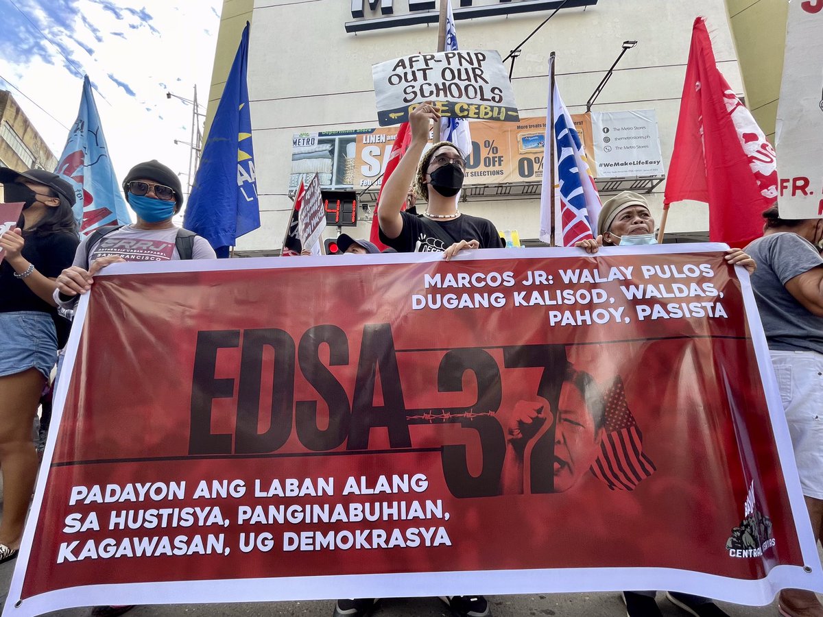 Around 100 human rights advocates and activists gathered in front of ...