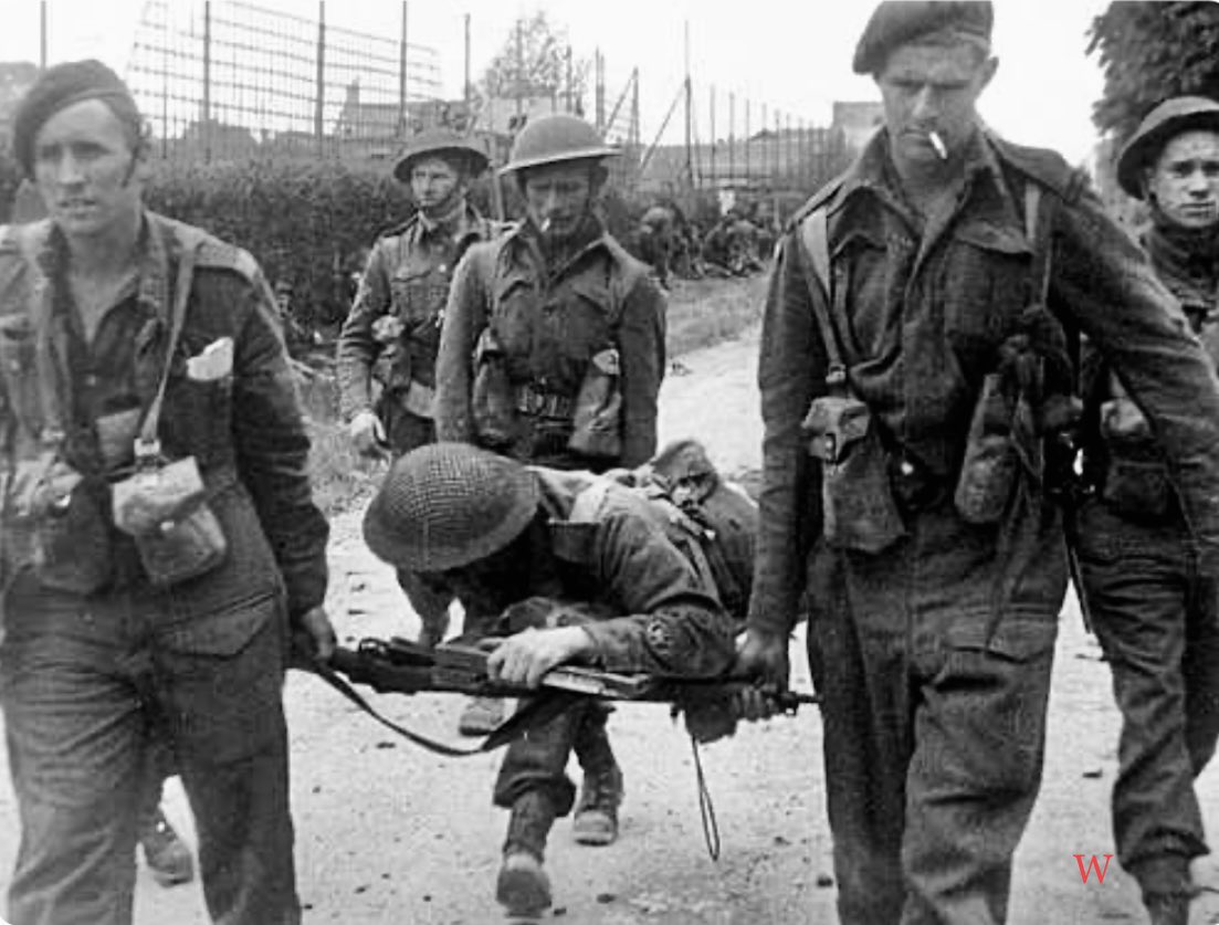 The World at War on Twitter: "British commandos use a makeshift stretcher to get one of their ...