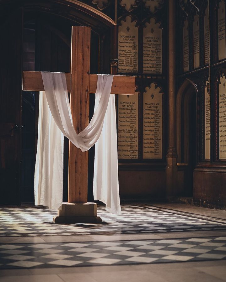 Cross With Cloth Draped Meaning