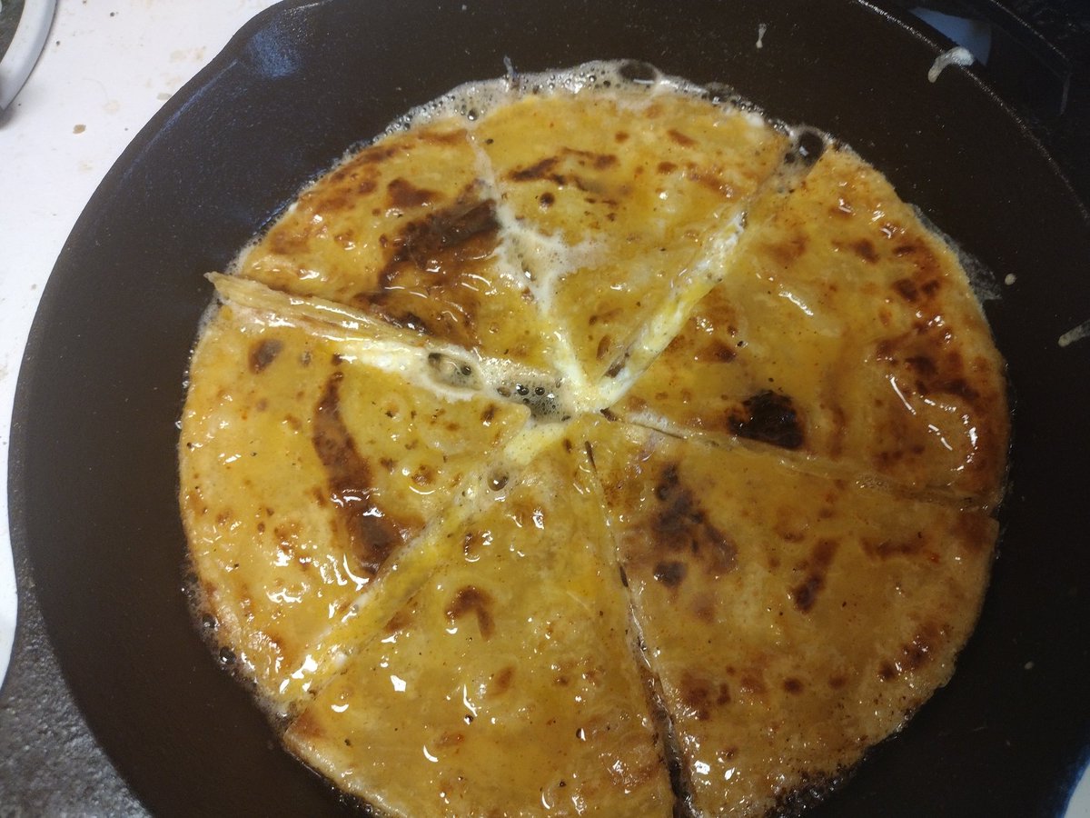 Had a leftover paratha. Cut it into slices, dipped in some eggs and ...