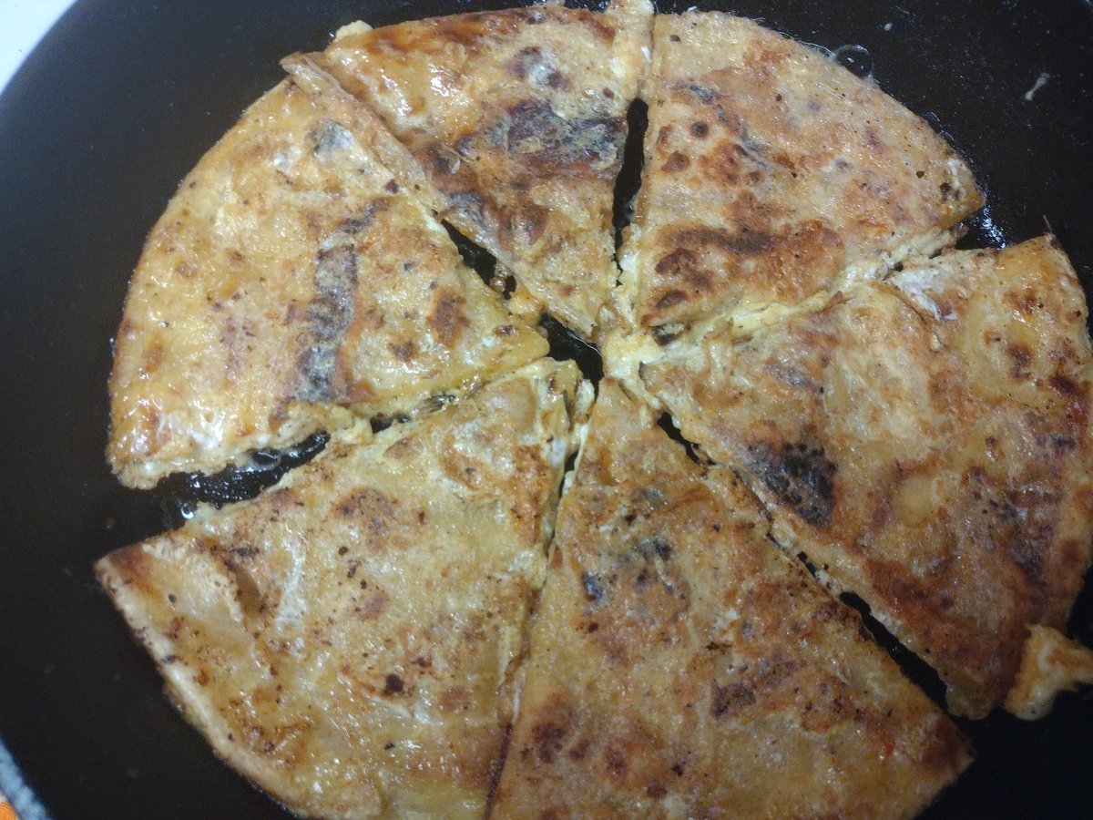 Had a leftover paratha. Cut it into slices, dipped in some eggs and ...