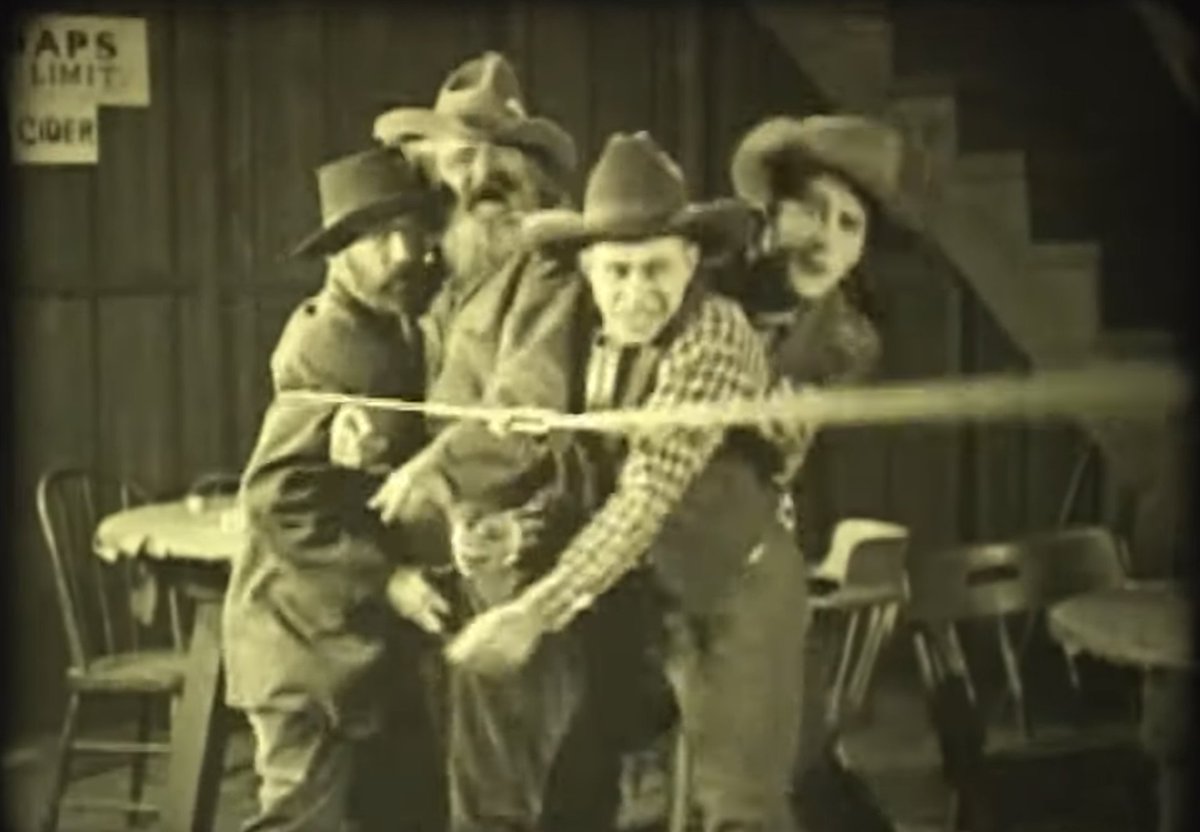 Art Acord ropes some fellas into having a drink with him in The ...
