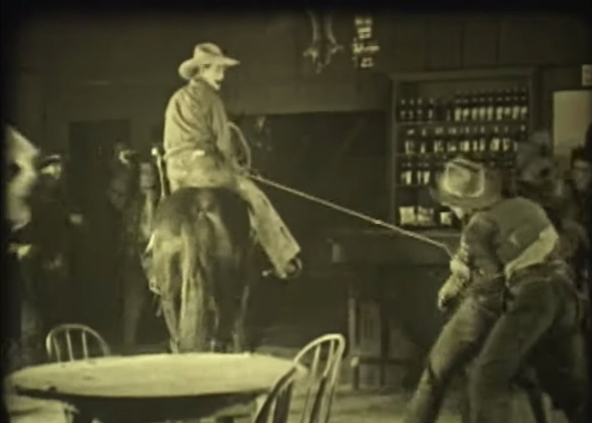 Art Acord ropes some fellas into having a drink with him in The ...