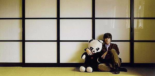 John Lennon at his house in Weybridge, Surrey, in his Japanese-style ...