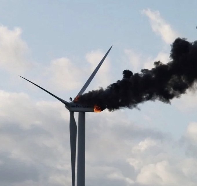 Image of two young engineers, aged 19 and 21, in a close embrace atop a ...