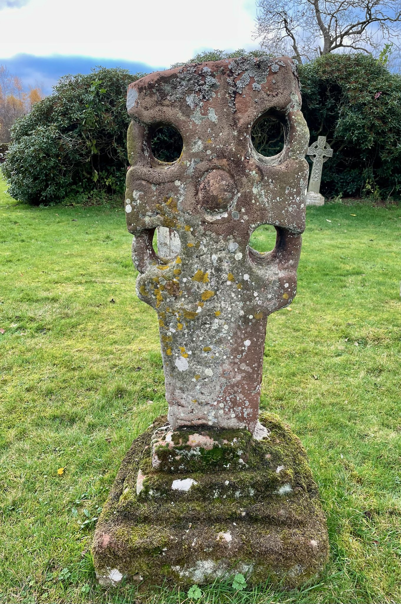 A Garden In A Big Cross On Stone