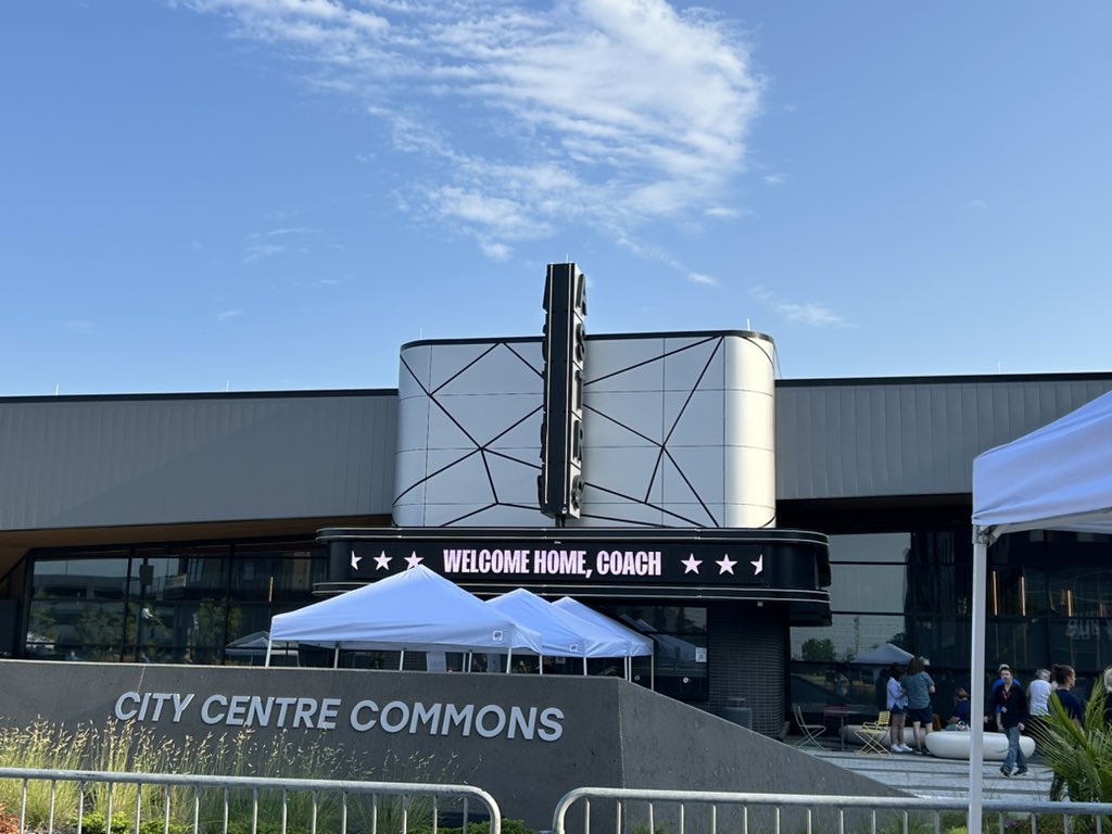 "Welcome Home, Coach" message on the venue of Tim Walz rally in Omaha ...