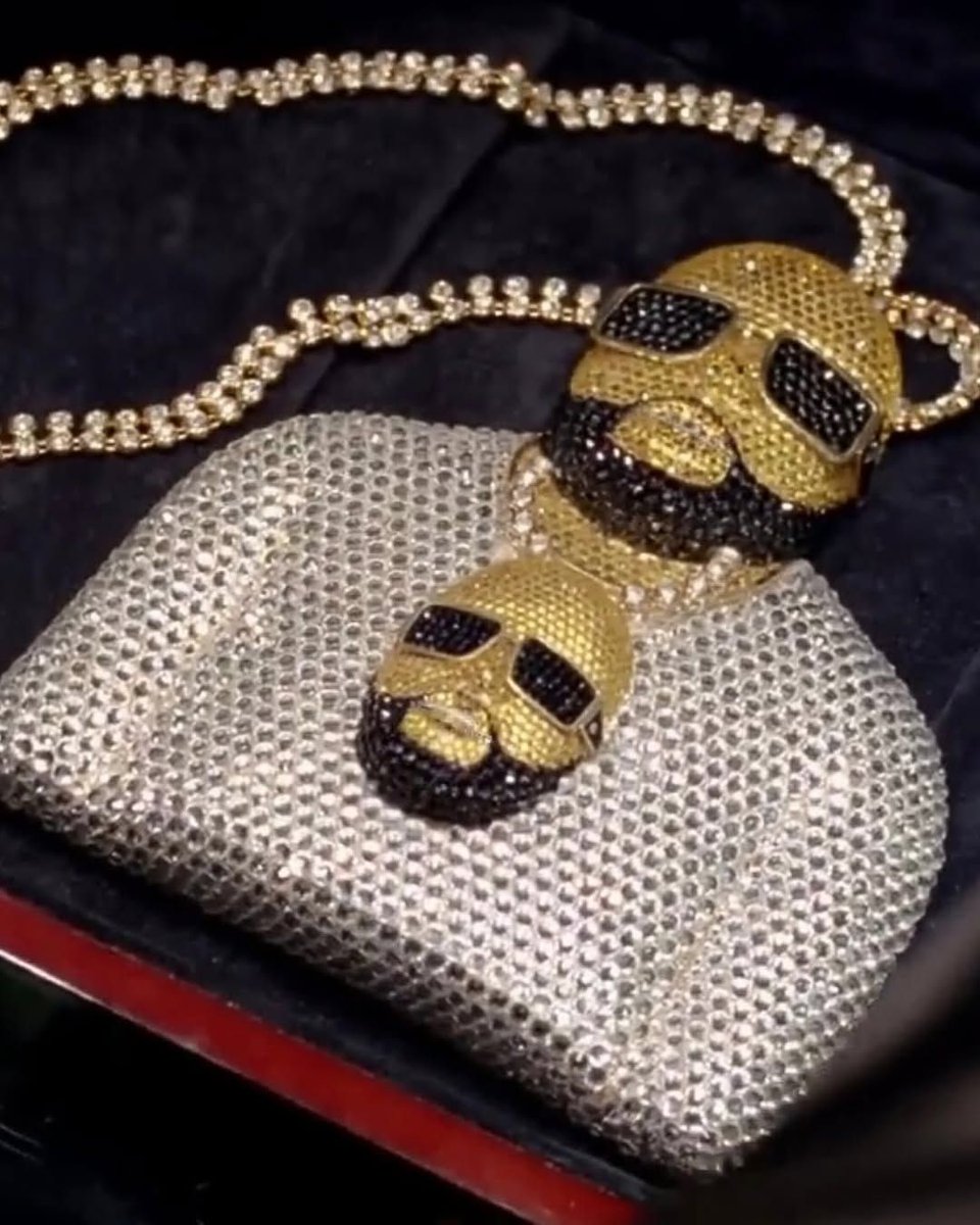 Rick Ross wearing a chain of himself wearing a chain of himself
