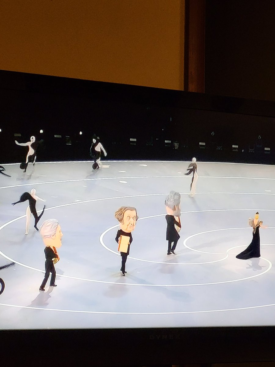 The Olympics has giant dancing heads! #rexcomus would be so proud