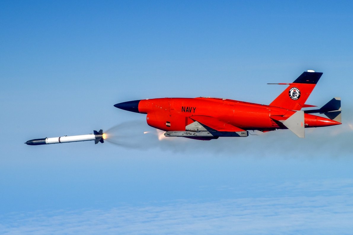 A BQM-34 unmanned aerial target releases a Solid Fuel Integral Rocket ...