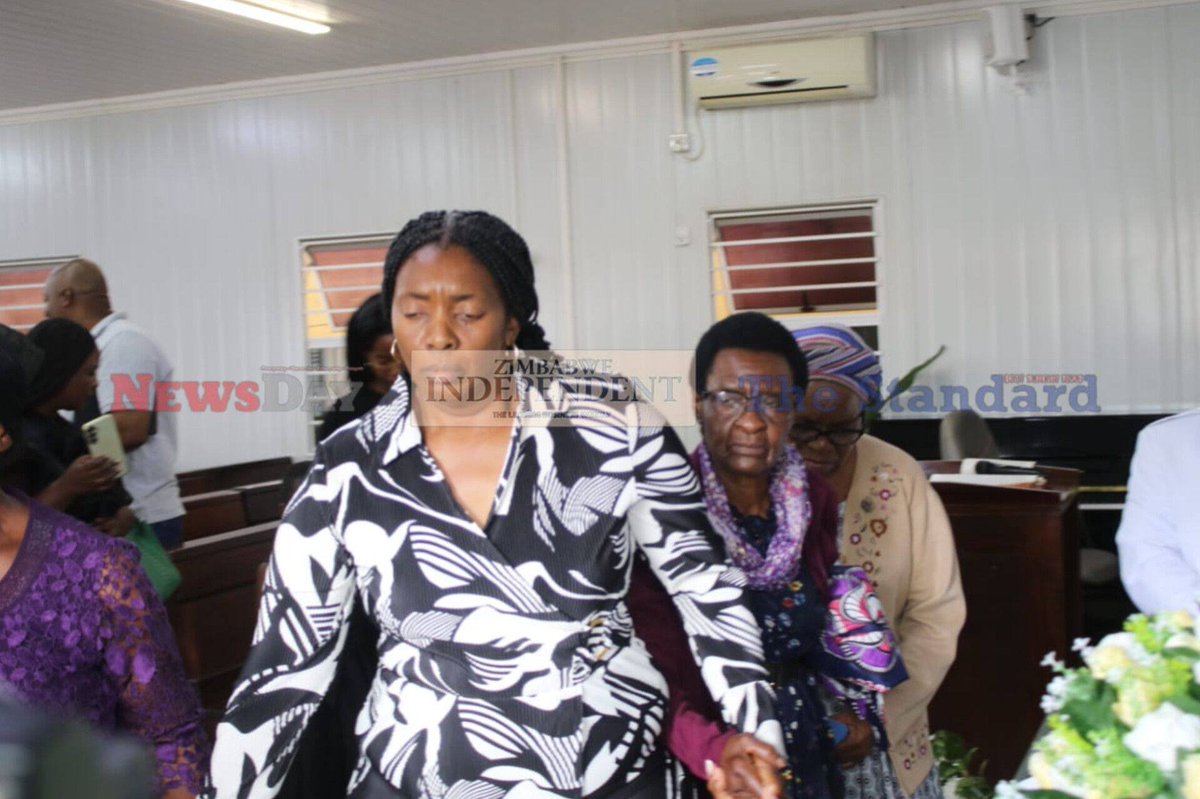 Cde Blessed Geza's wife during the funeral service at Nyaradzo Funeral ...