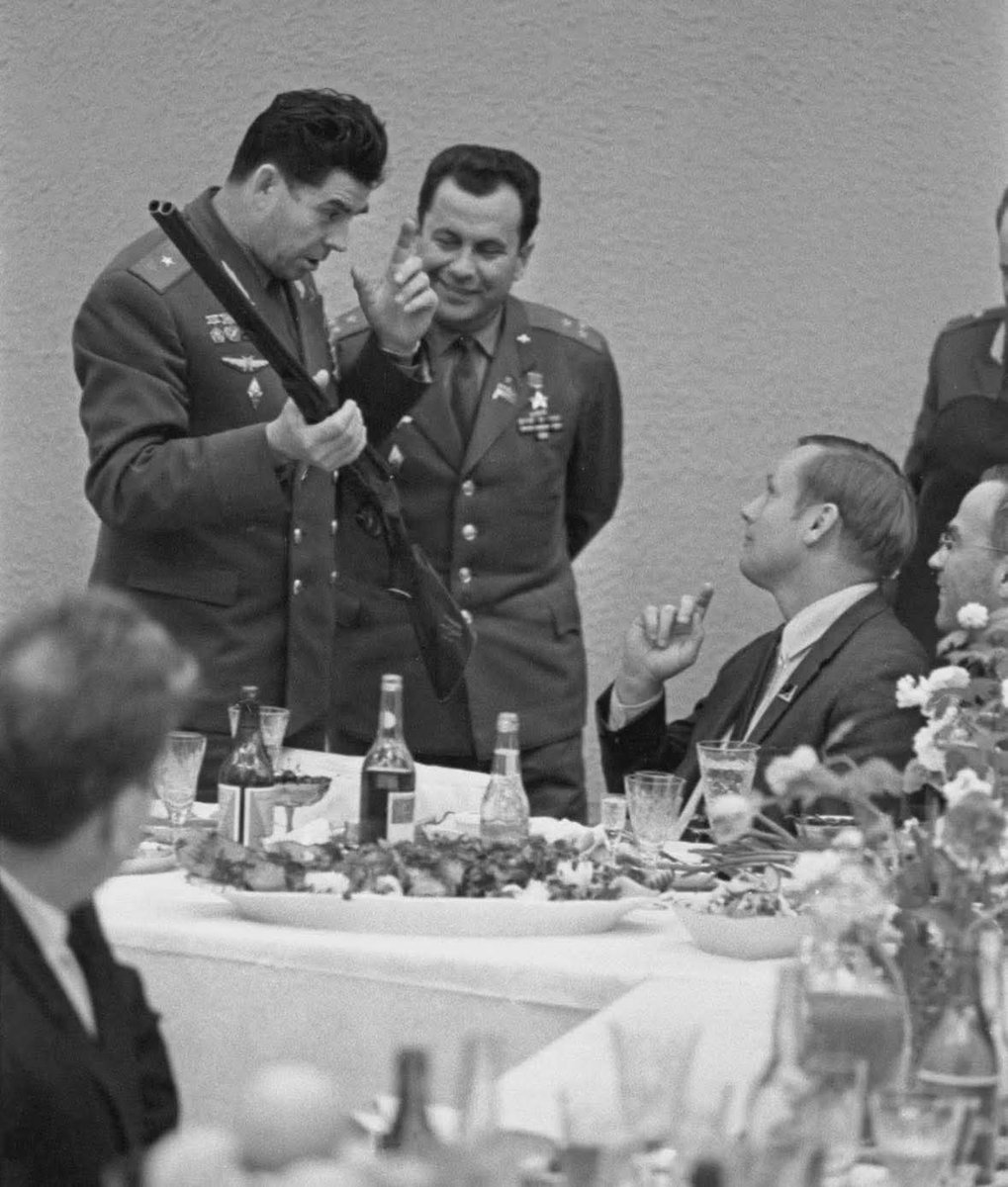 Soviet cosmonauts Georgy Beregovoy and Pavel Popovich present a hunting ...