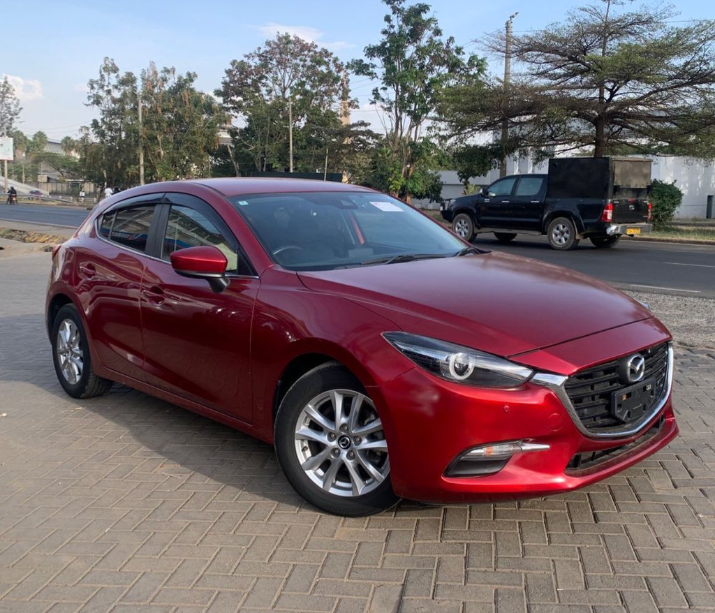 Which purchase would make more sense? • A 2018 Mazda Axela (wine-red ...