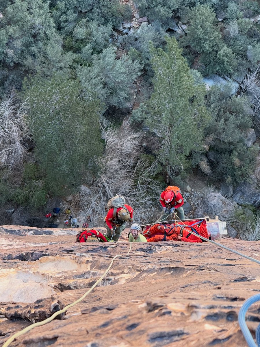 Rescuers then constructed a lowering system and lowered the victim ...