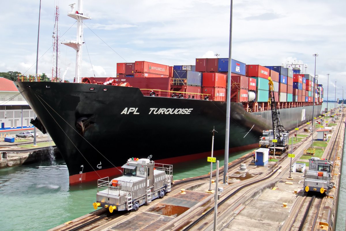 Inside the locks of the Panama Canal, the space between a large vessel ...