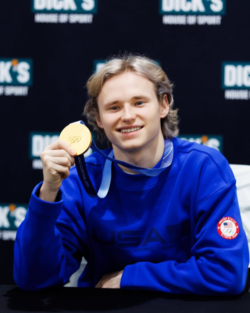 Ilia Malinin with his Olympic Team gold medal at the DICK's Sporting ...