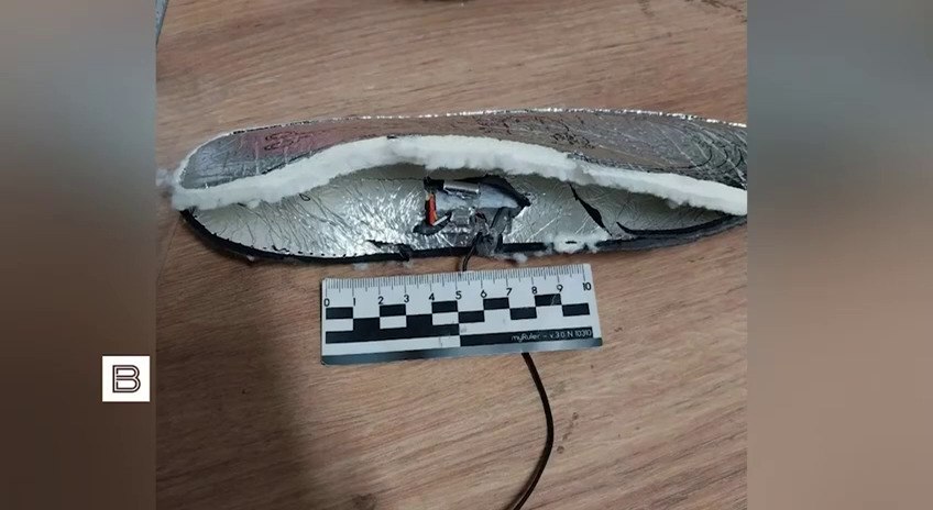 A covert network distributed explosive insoles containing 1.5 grams of ...