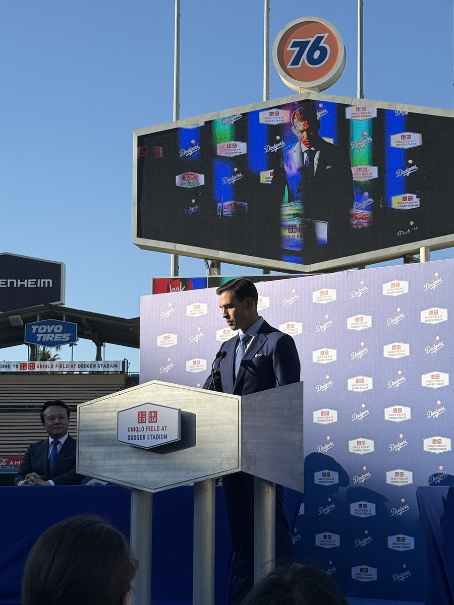 Joe Davis is at the podium officially announcing the partnership ...