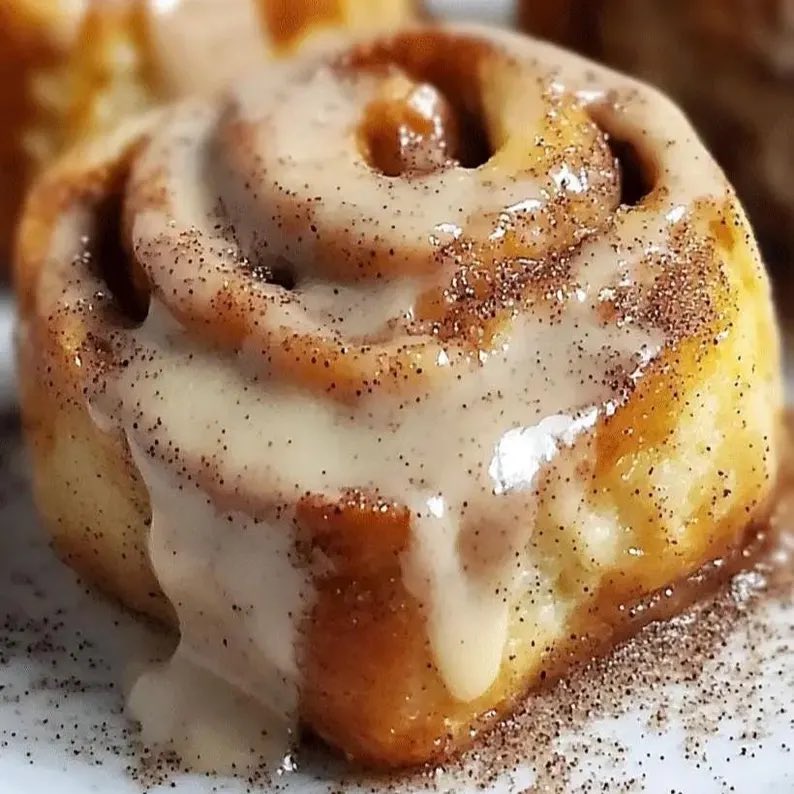 Cinnamon roll with cFreshly baked sweet roll glazed with vanilla ...