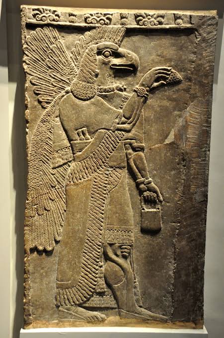 This gypsum wall relief depicts an eagle-headed and winged man; this is ...