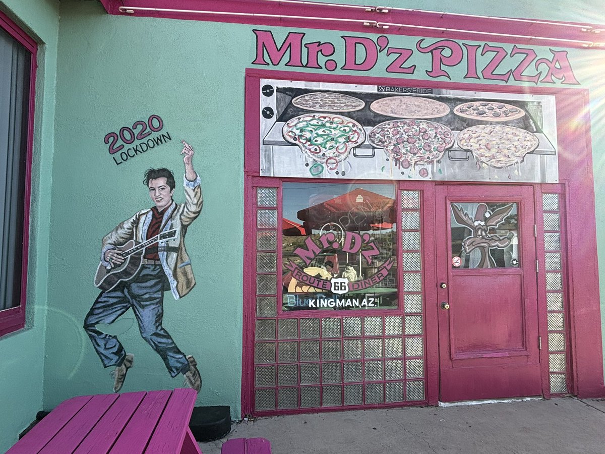 Me: Why is Elvis flipping everybody off? My husband: Look at the sign ...