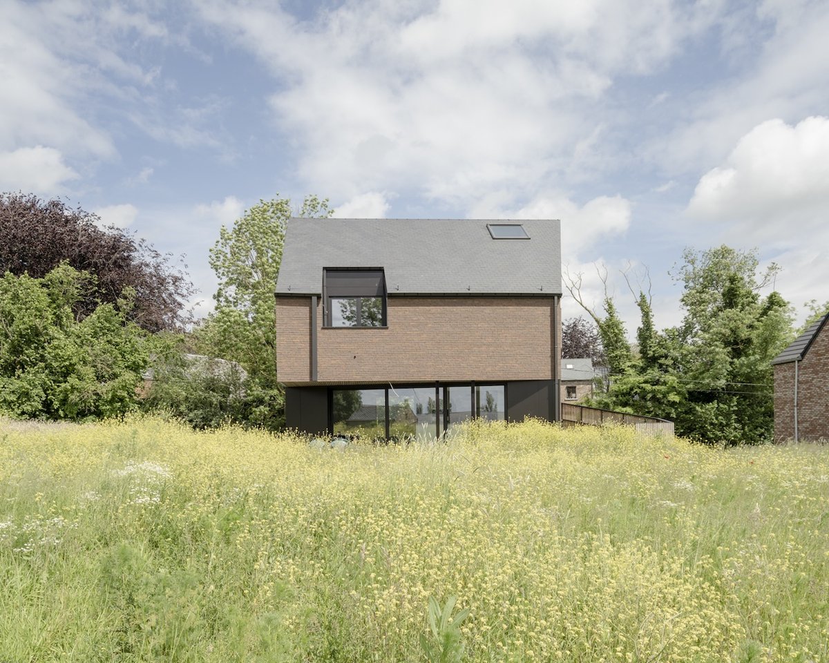 Designed around a split-level site, this house separates family life ...